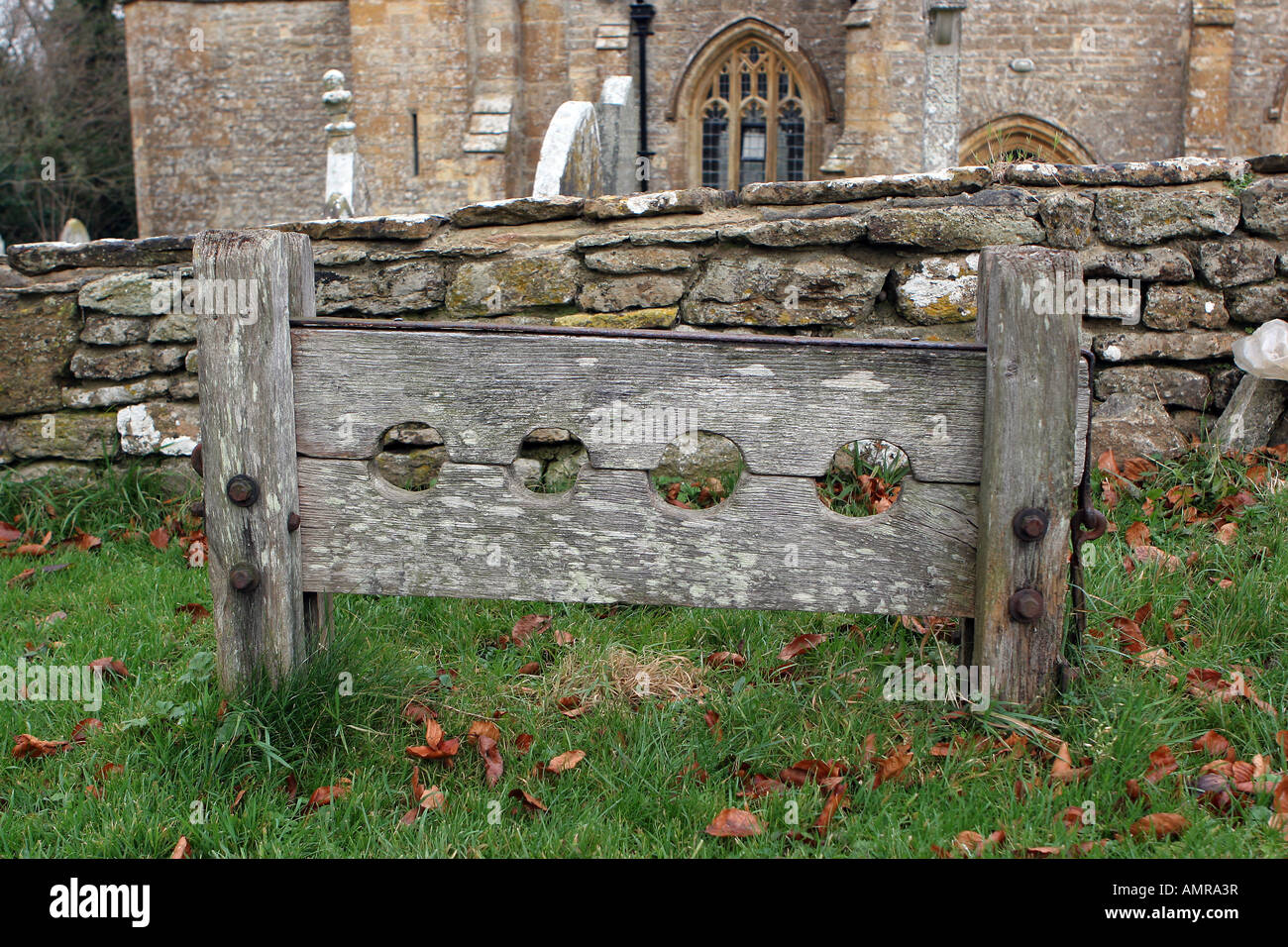 The stocks outside Holwell Church near Sherborne in Dorset Stock Photo ...