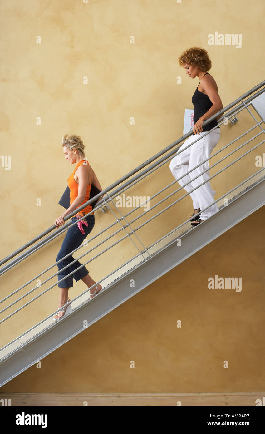 Woman descending stairs dress hi-res stock photography and images - Alamy
