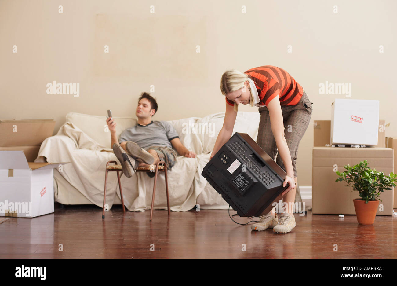Lifting tv hi-res stock photography and images - Alamy