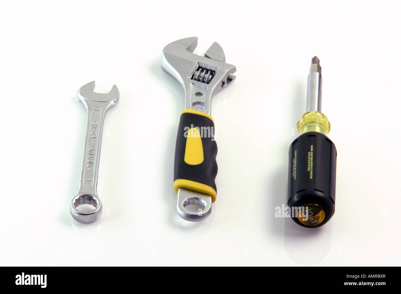 three work tools wrench and screwdriver isolated on white background ...
