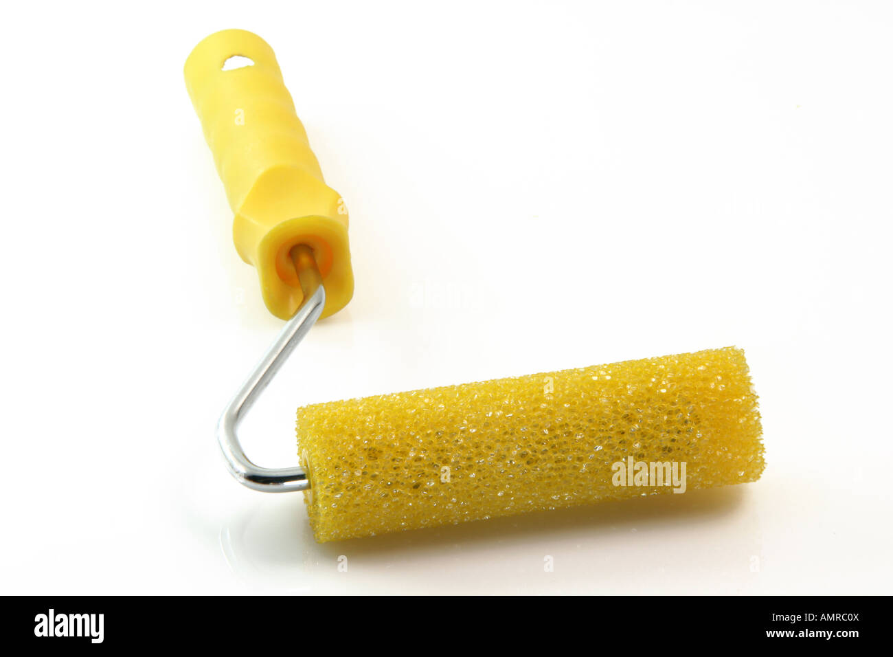small yellow paint roll isolated on white background hardware tools ...