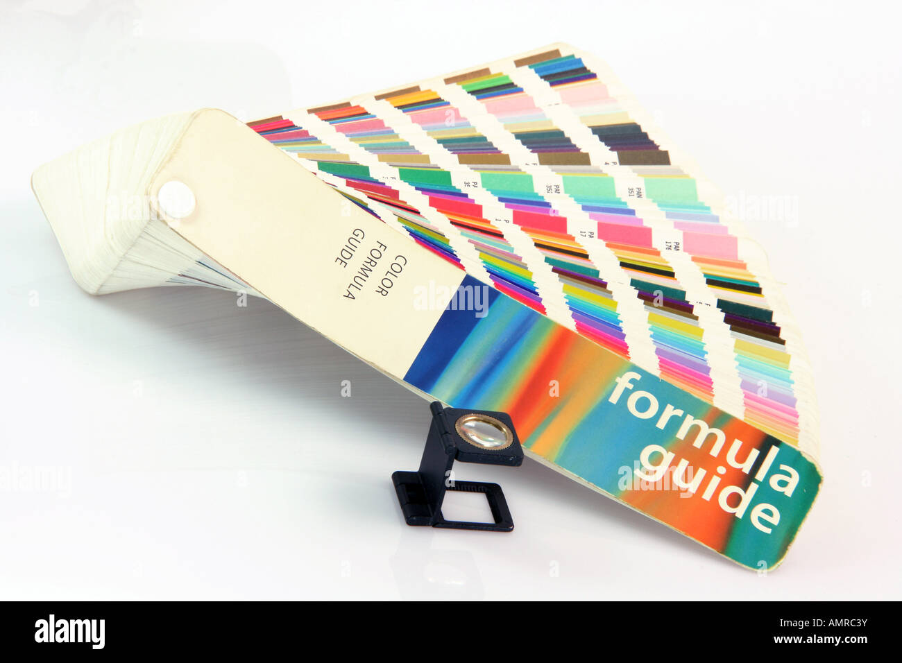 pantone colors formula guide with graphic art loupe lense isolated on ...
