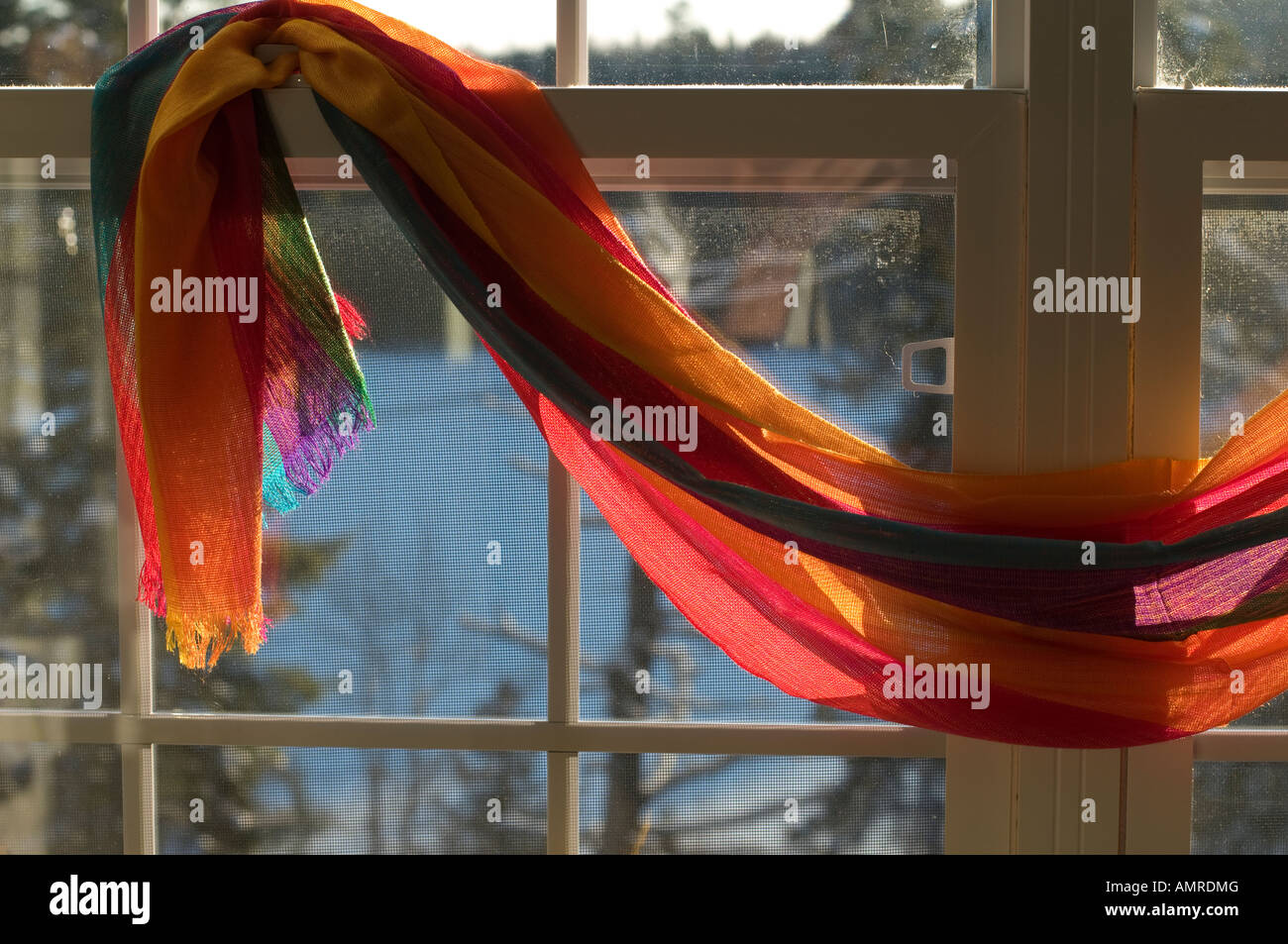 Multi coloured cloth draped on window Stock Photo - Alamy
