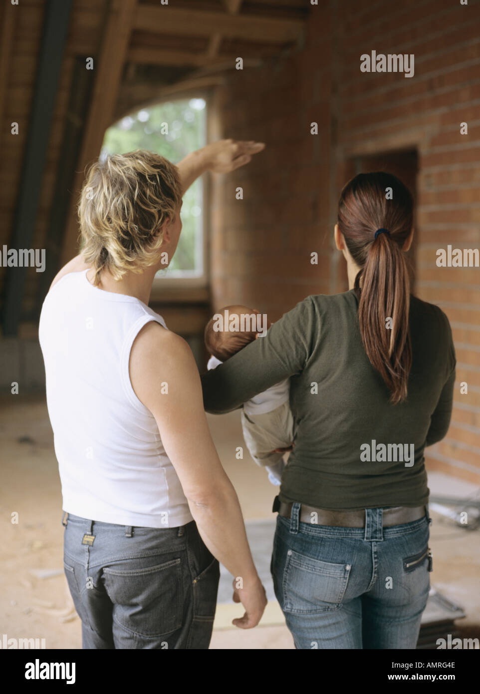 Young family visiting their future home Stock Photo - Alamy