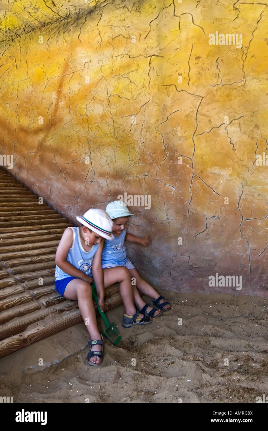 kids play in cave on playground Stock Photo - Alamy
