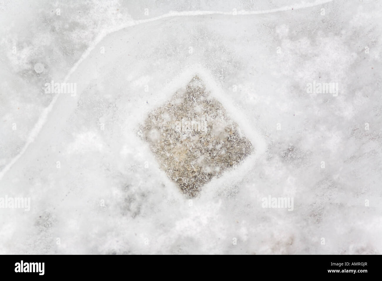 stone on ice Stock Photo - Alamy