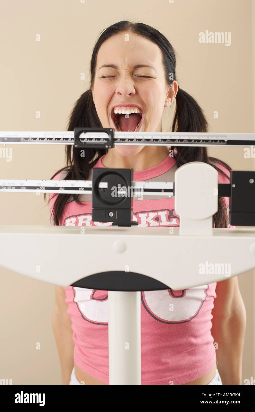 Old women on scale weighing hi-res stock photography and images - Alamy