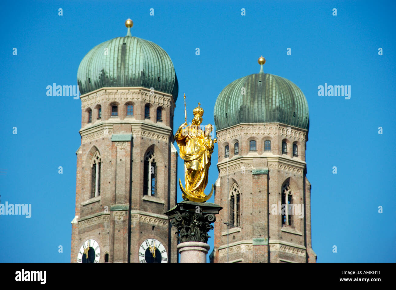 Column of Maria between towers of church Frauenkirche Marienplatz ...