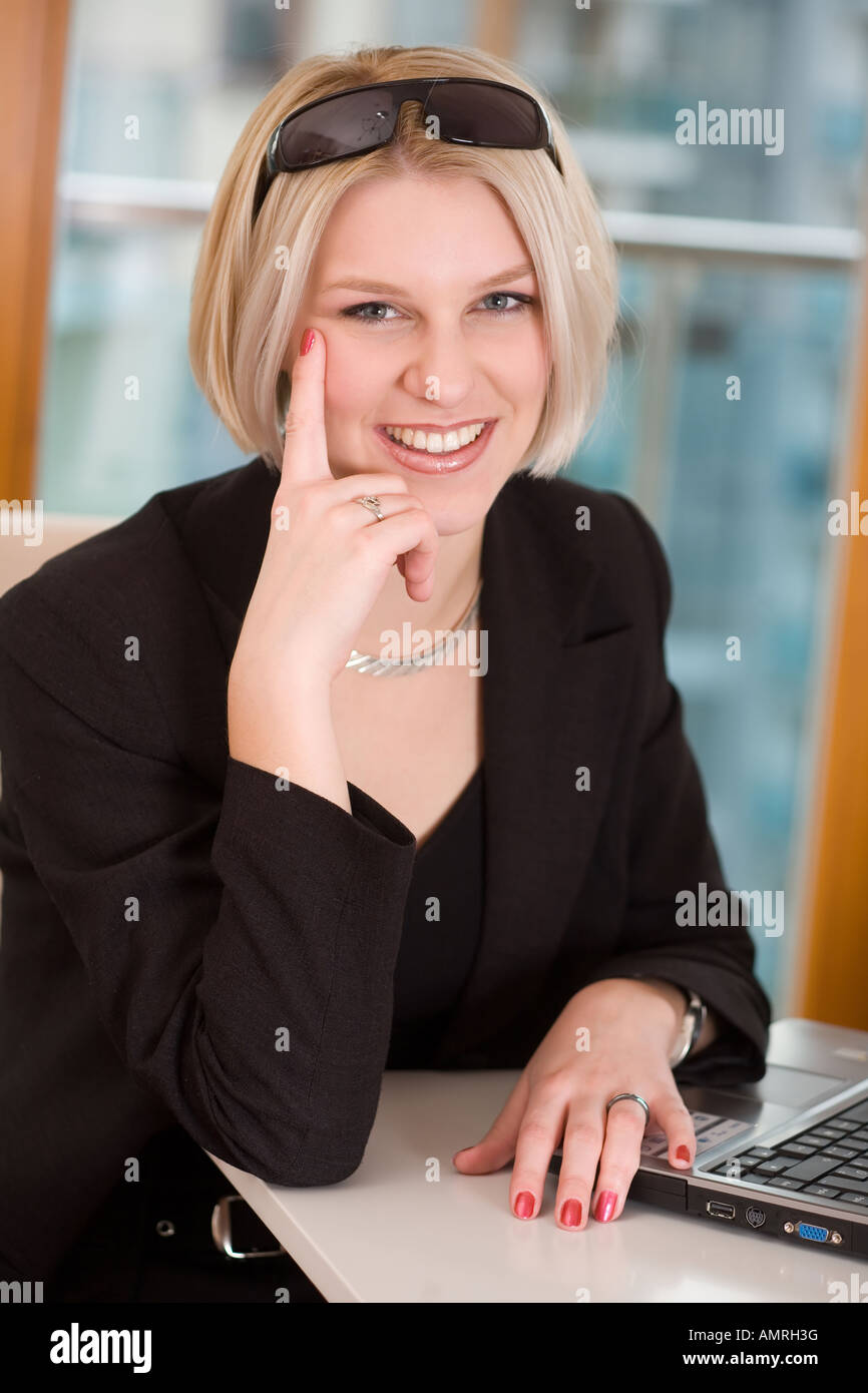 smiling businesswomen and laptop Stock Photo - Alamy smiling businesswomen and laptop Stock Photo - Alamy