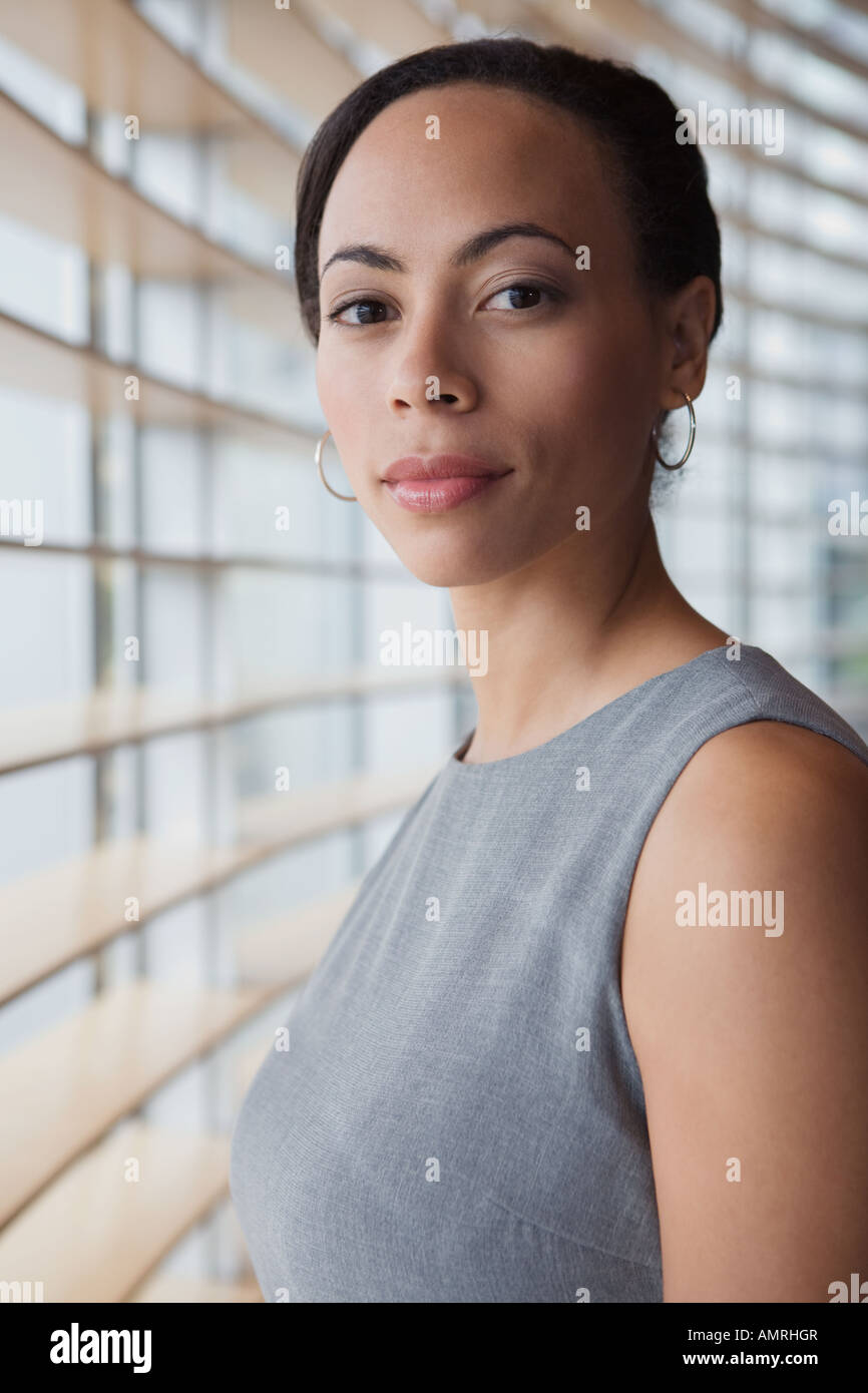 African woman next to window Stock Photo - Alamy