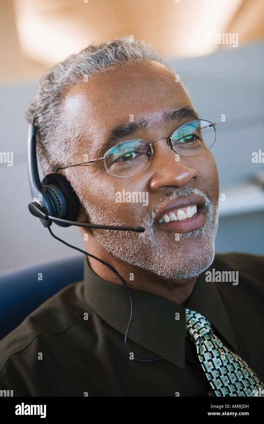 African businessman wearing headset Stock Photo - Alamy