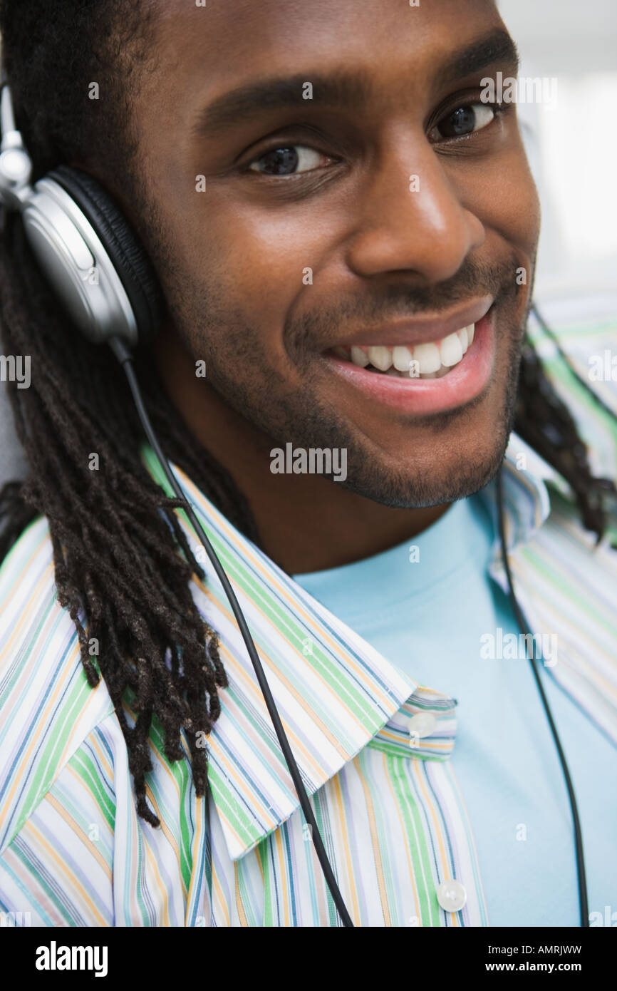 African man listening to headphones Stock Photo - Alamy