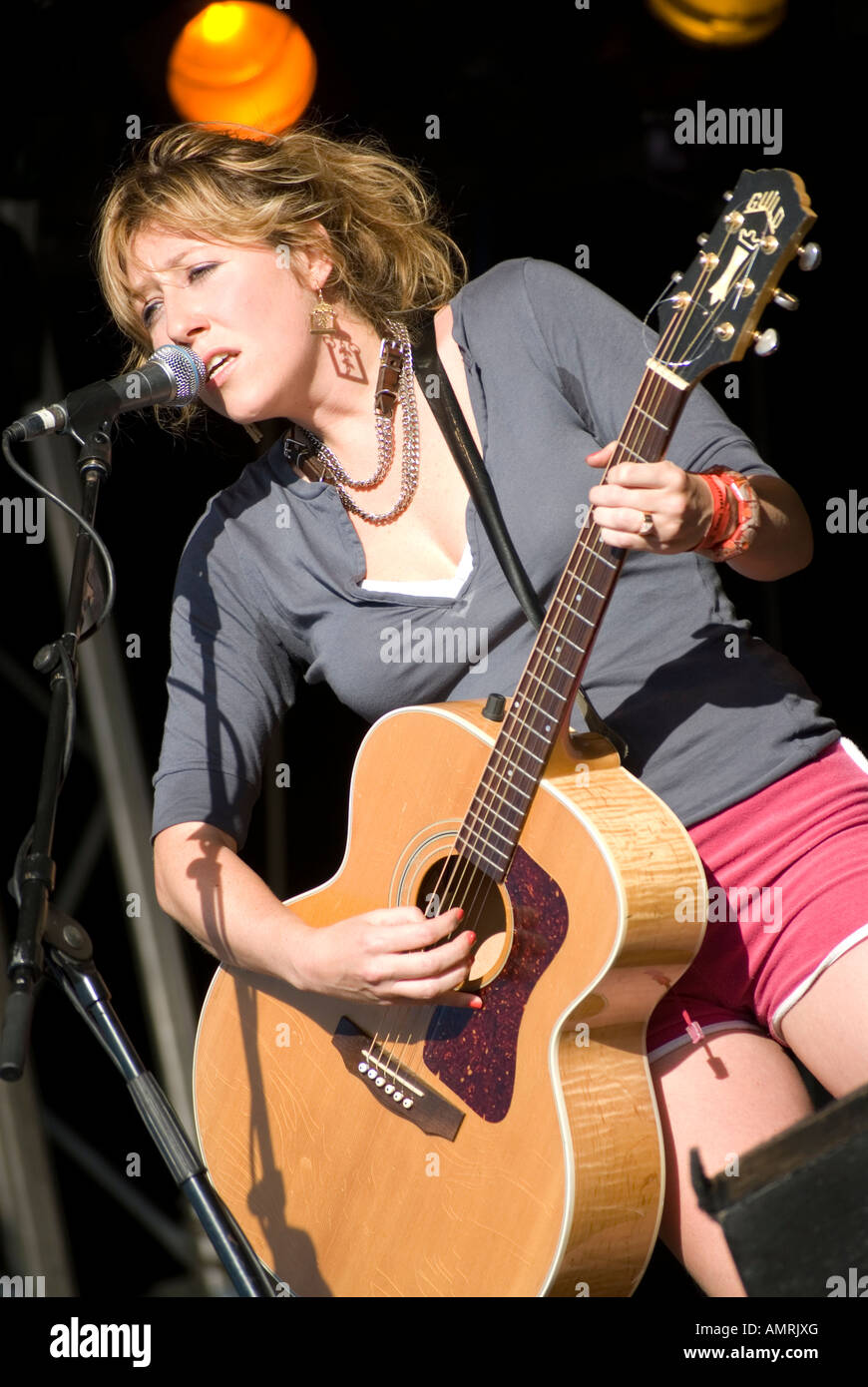 Martha Wainwright on stage singing and playing guitar at Wychwood ...