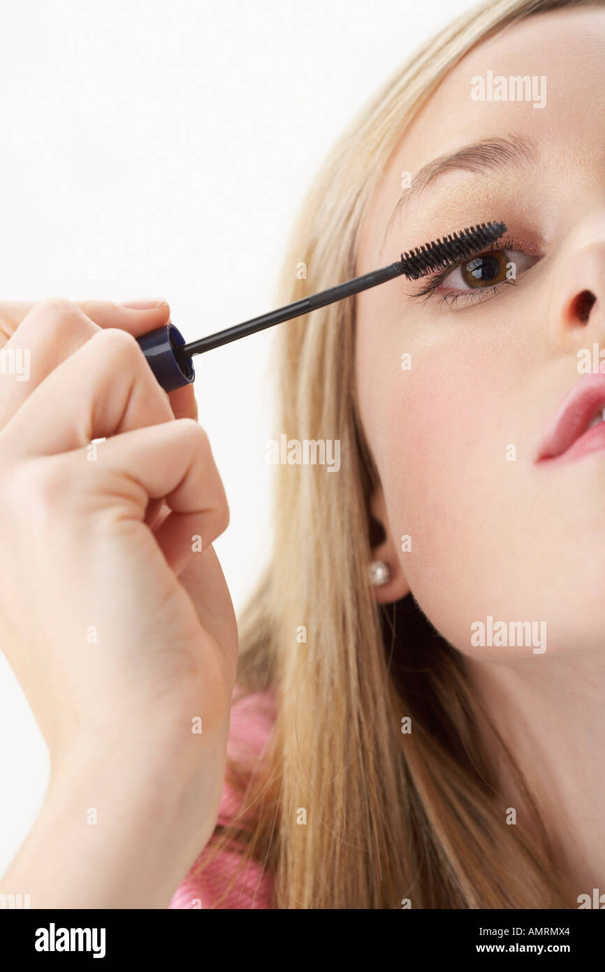 Girl applying mascara hi-res stock photography and images - Alamy