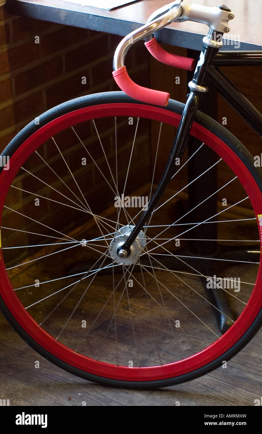Red Bike Wheel in coffee shop Stock Photo - Alamy