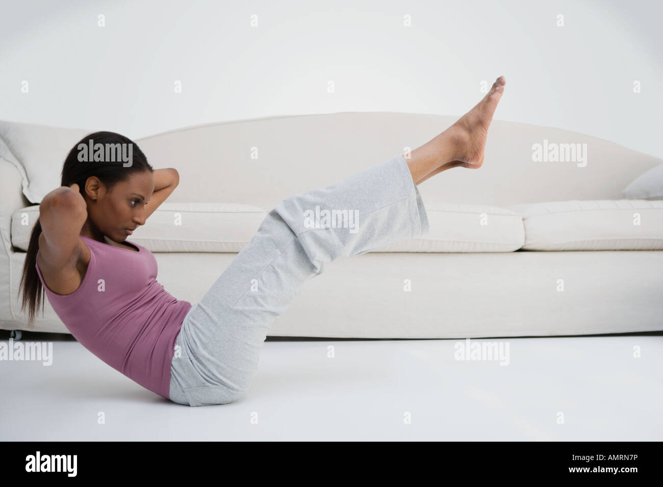 African woman exercising in living room Stock Photo - Alamy