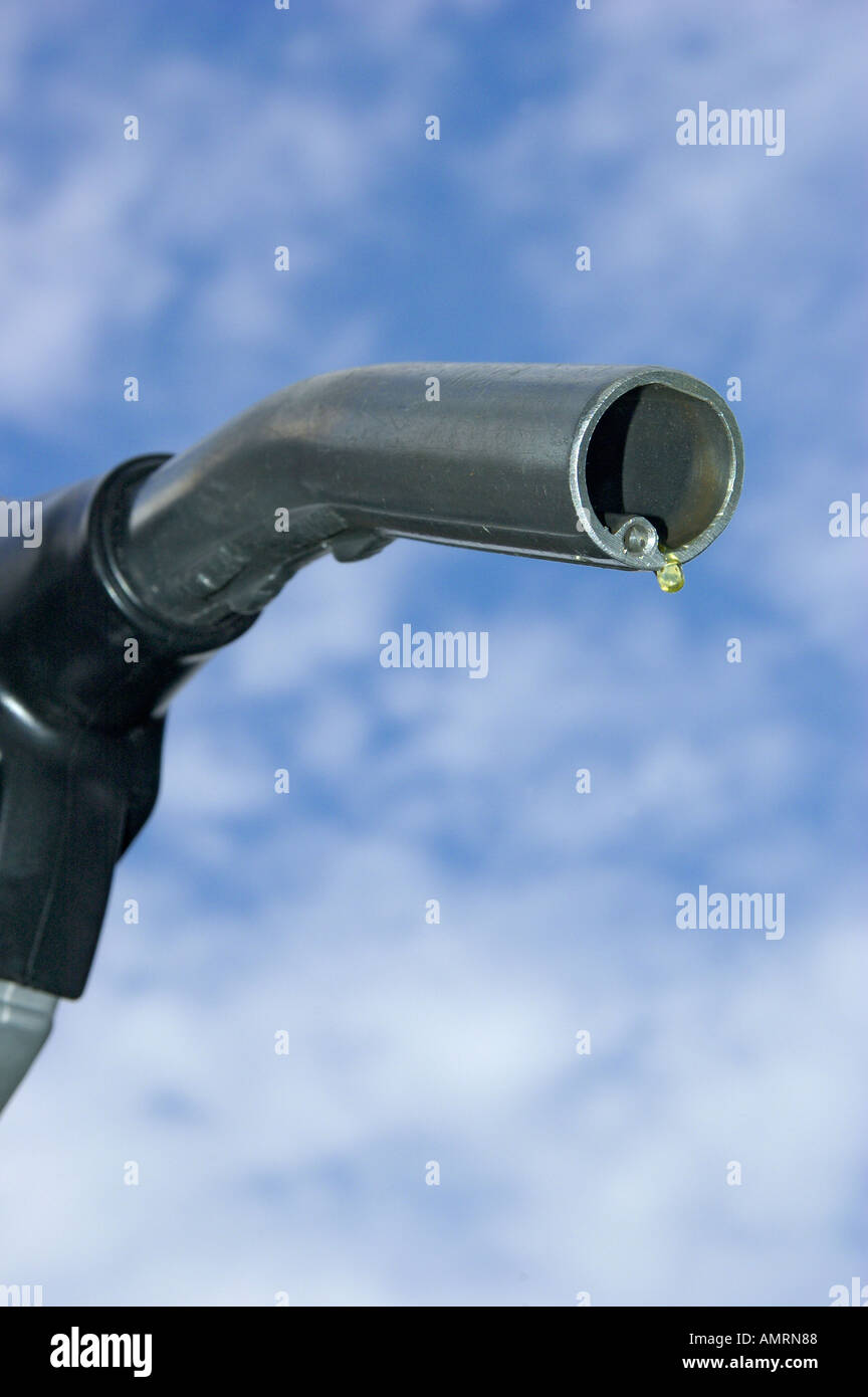 Dripping fuel pump in front of a blue sky Stock Photo - Alamy