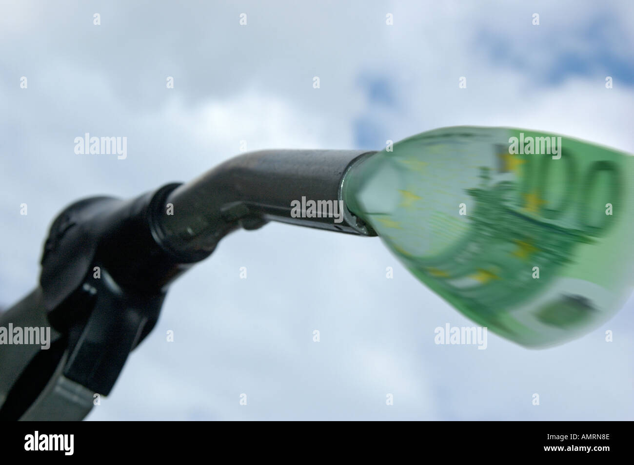 Money bill gushing from a fuel pump Stock Photo - Alamy