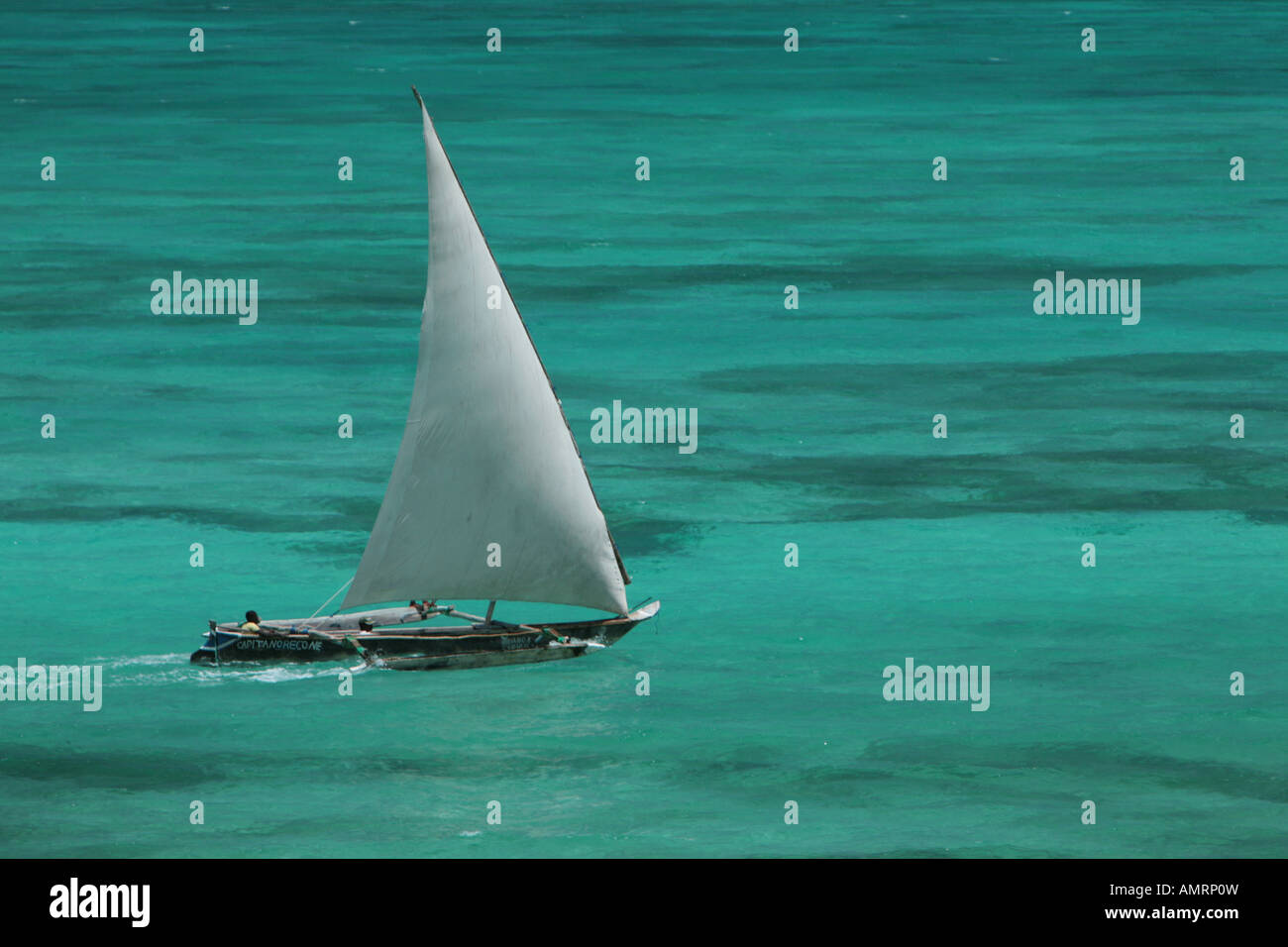 Traditional sailing dhow off the coast of Zanzibar Tanzania Africa ...