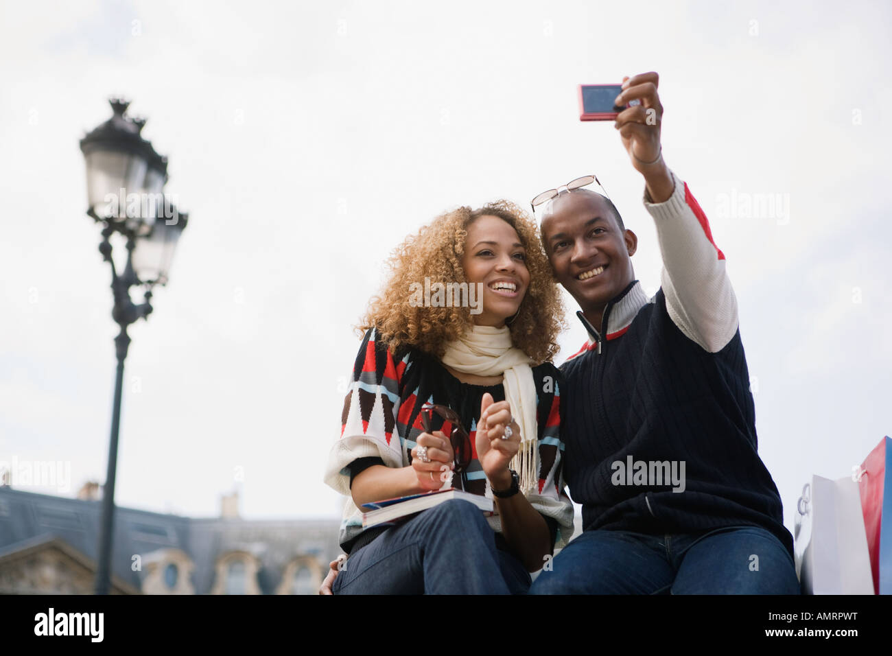 African couple taking own photograph hi-res stock photography and ...