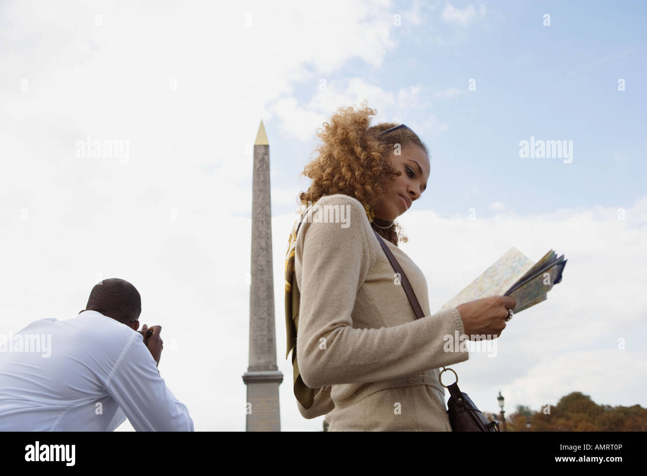 African woman looking at map Stock Photo - Alamy