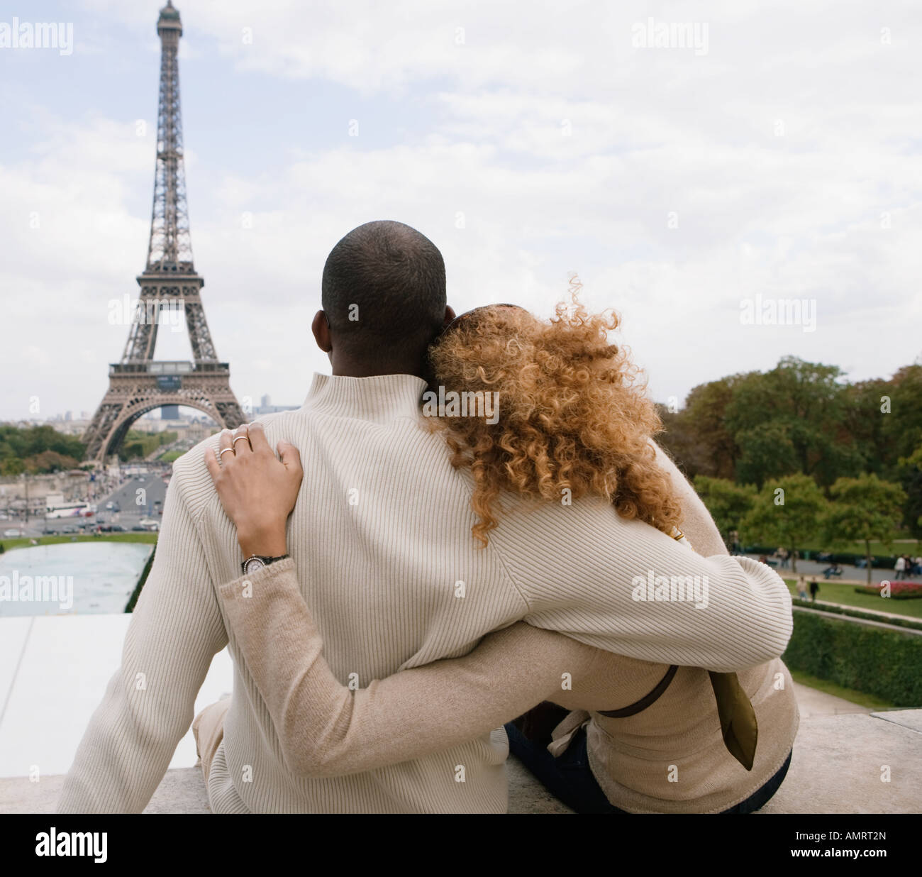 Rear view of African couple hugging Stock Photo - Alamy