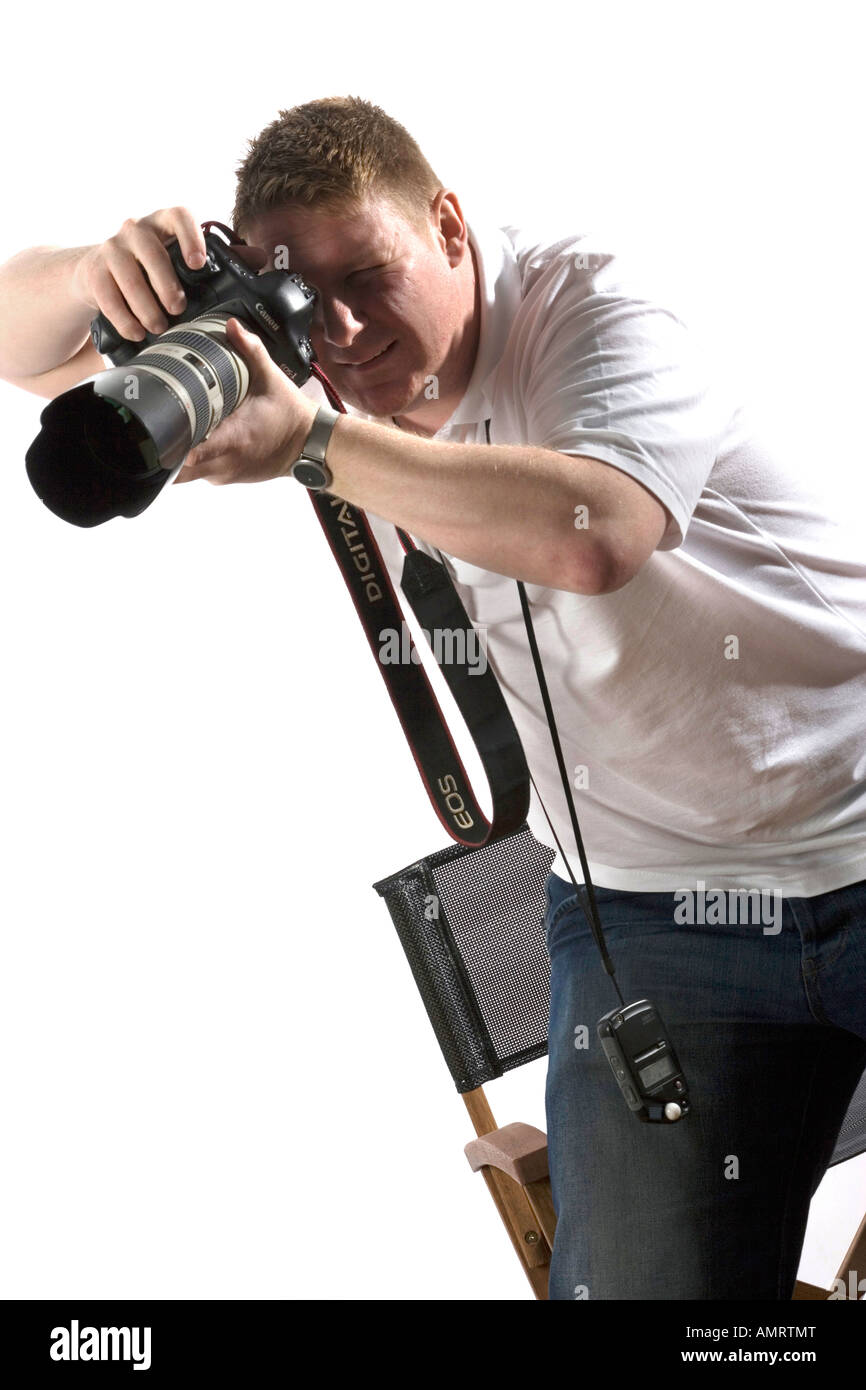 Expert Professional photographer with camera in studio Stock Photo - Alamy