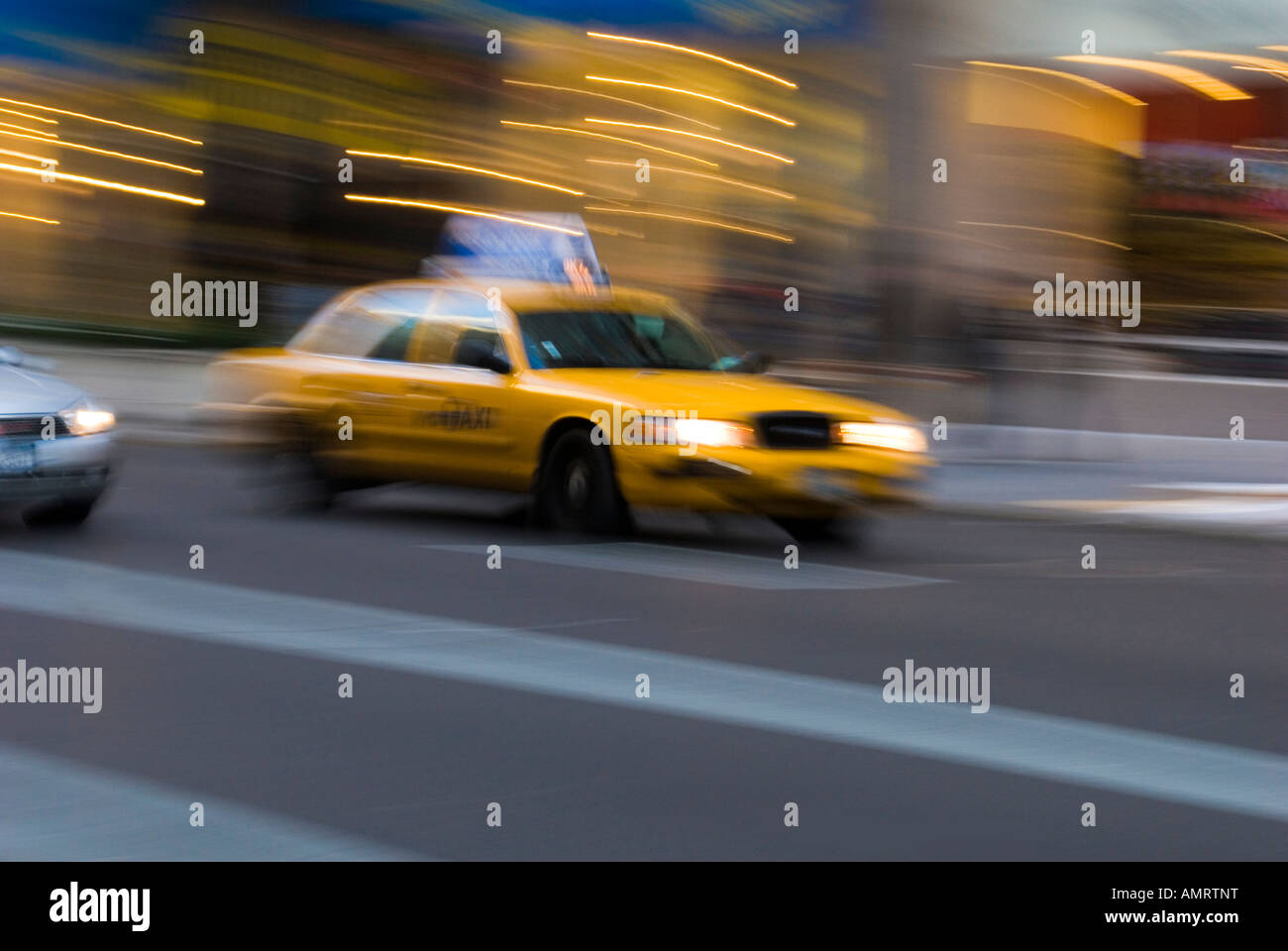 Blurred Moving New York City Yellow Cab Stock Photo - Alamy
