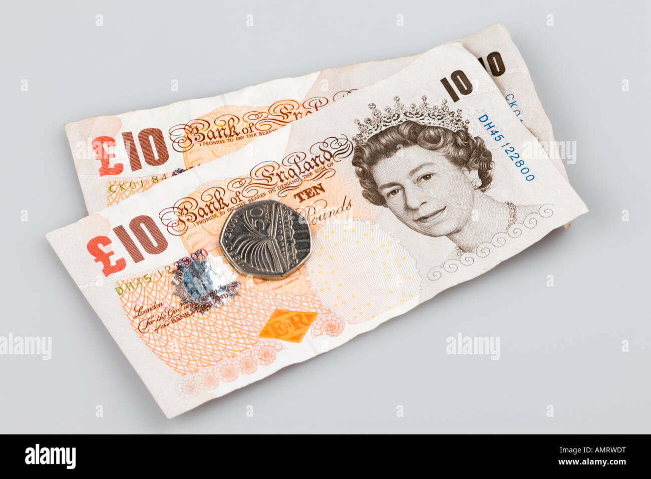 Two 2 ten pound notes and fifty pence piece Stock Photo - Alamy