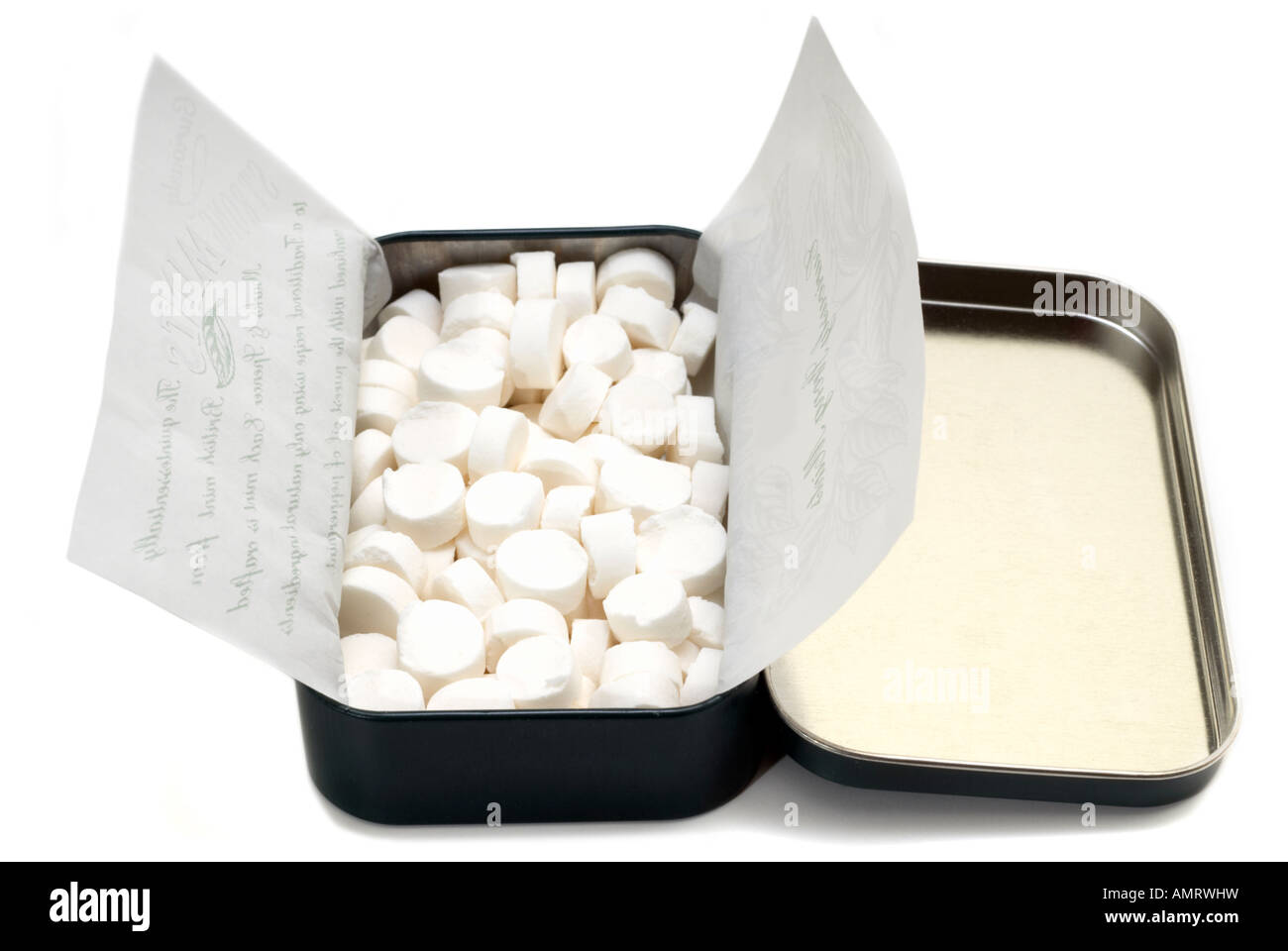 Open green tin of white ^strong "travel mints Stock Photo - Alamy