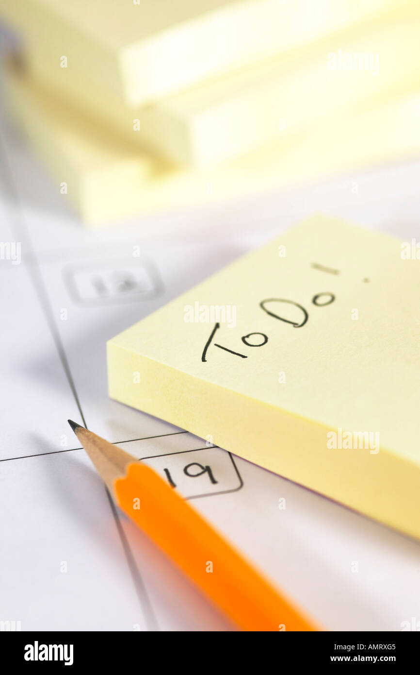Sticky Notes, Pencil and Desk Calendar Stock Photo - Alamy