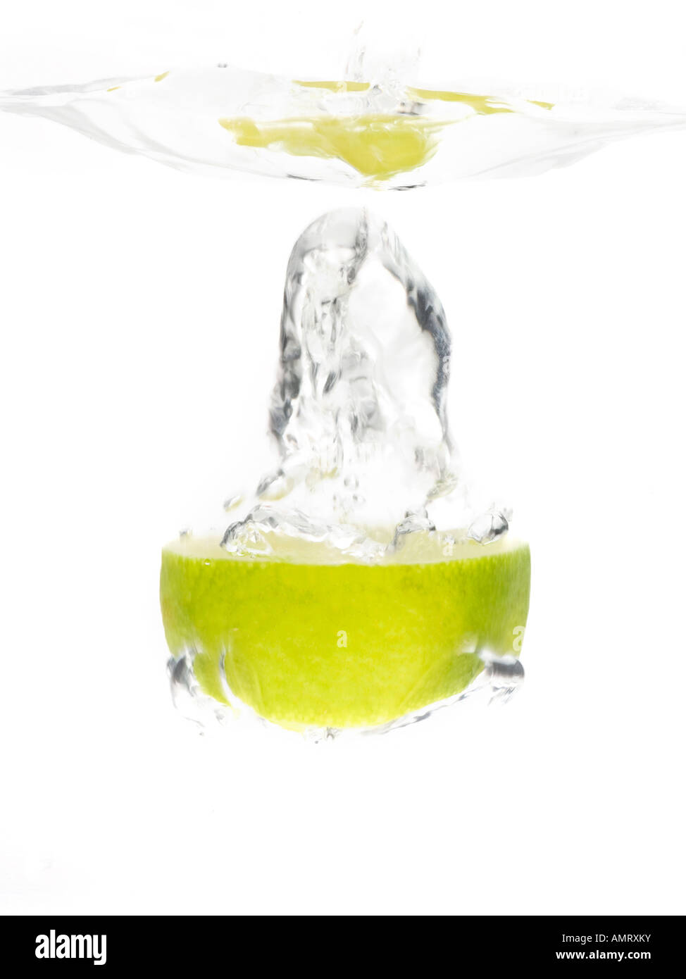 Lemon dropping into water and splashing Stock Photo - Alamy