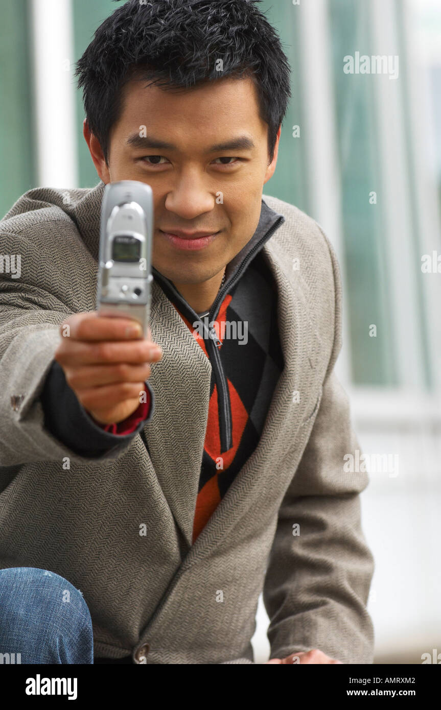 Man Taking Photo with Camera Phone Stock Photo - Alamy