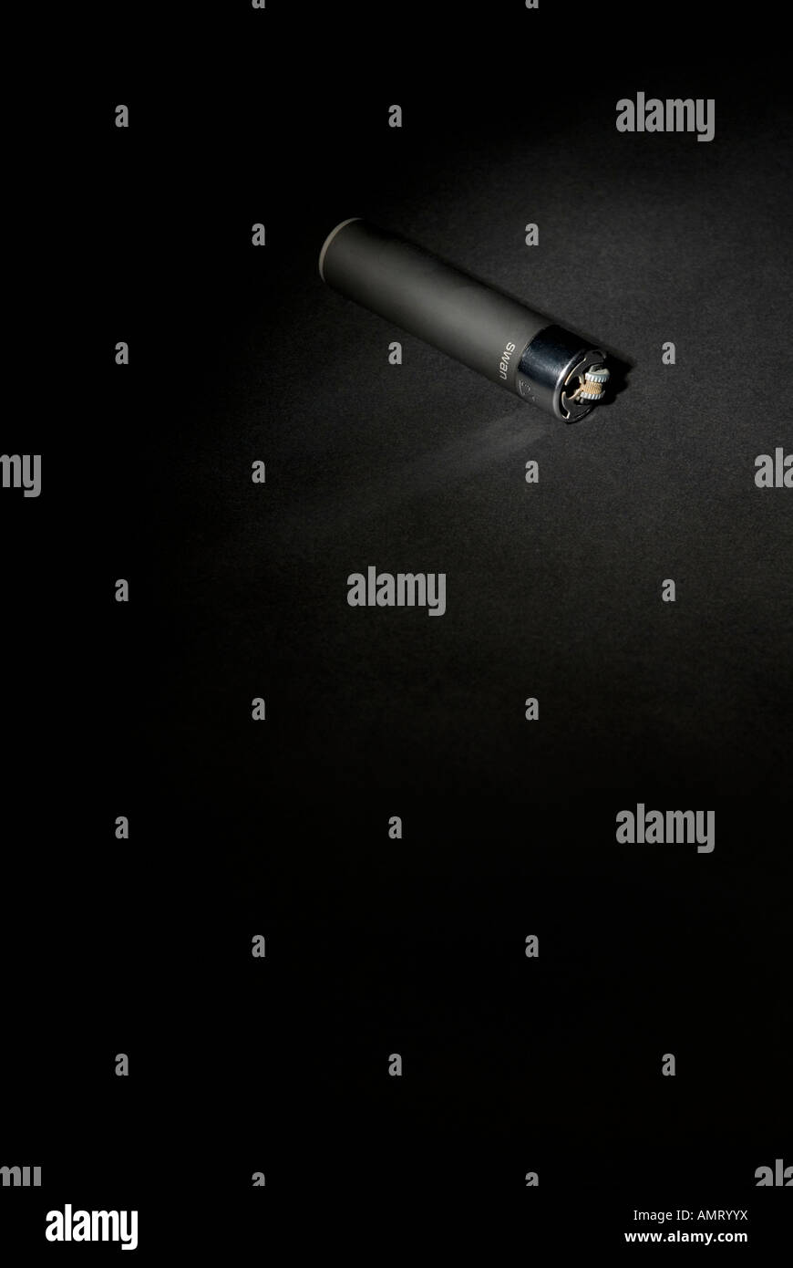 Clipper cigarette lighter in subdued lighting Stock Photo - Alamy