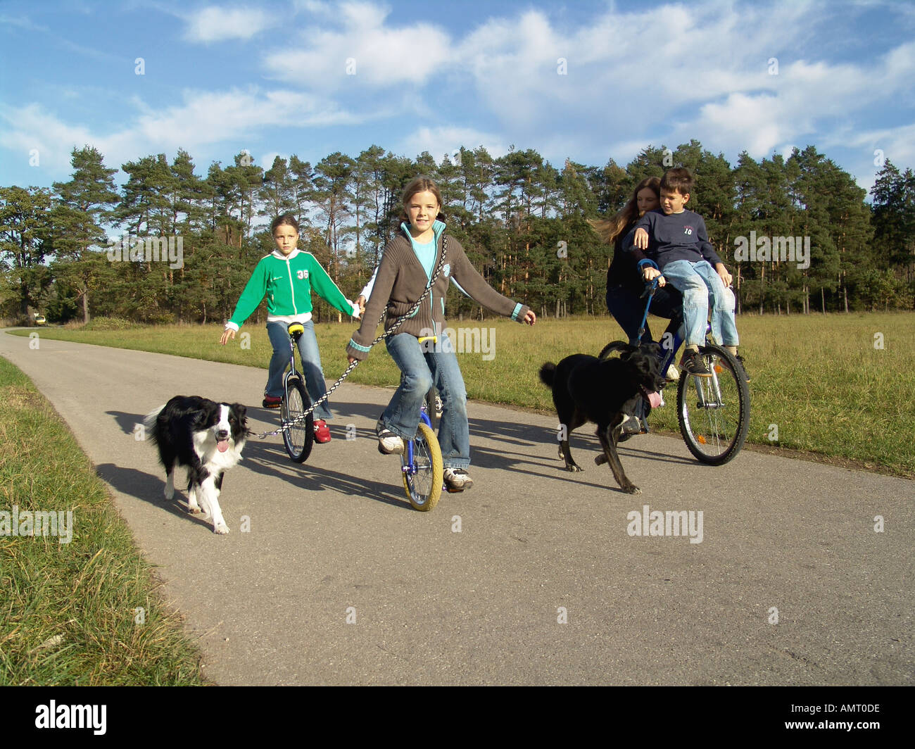 children two girls 10 14 years unicycle cycle sport circus skill ...