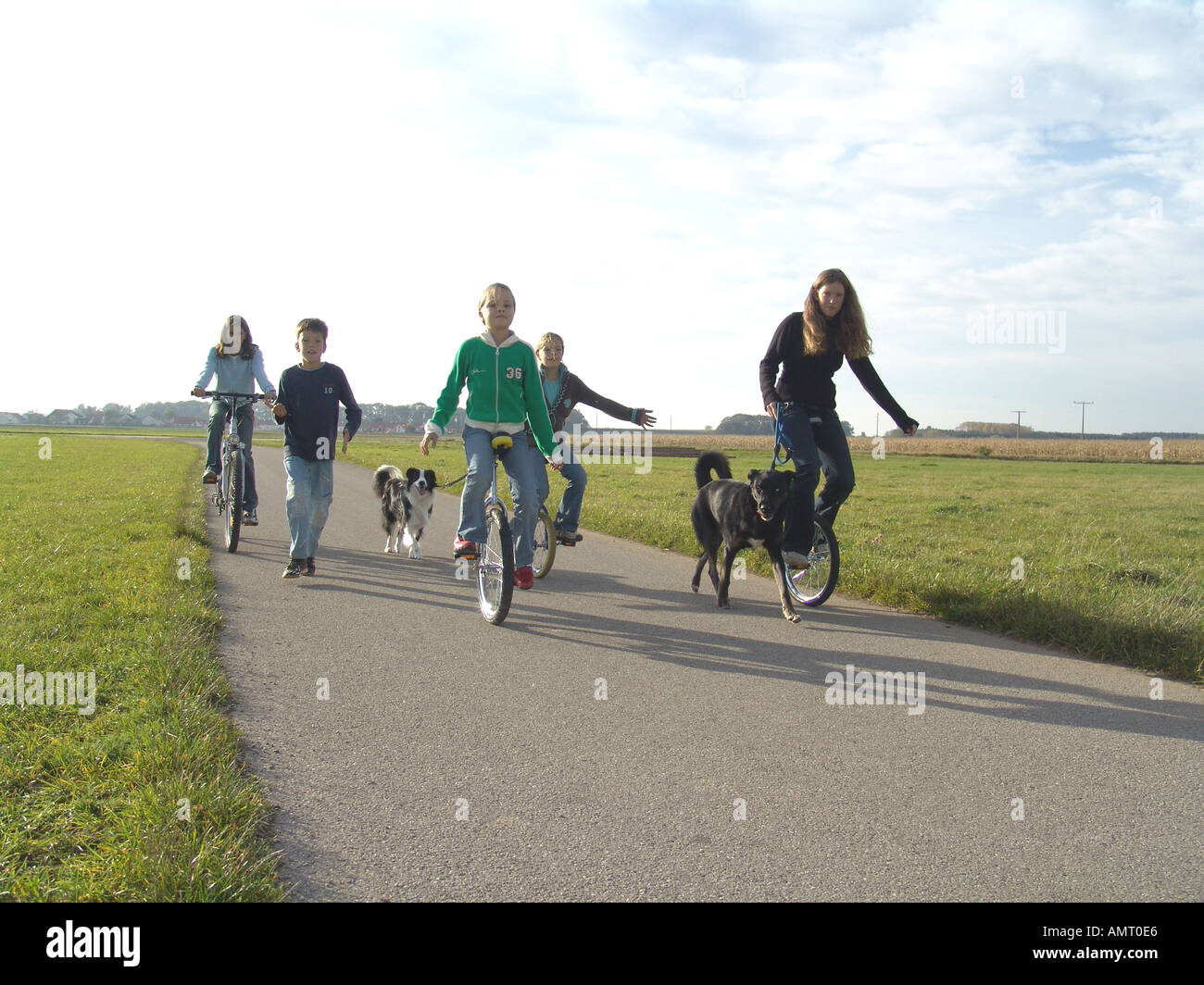 children two girls 10 14 years unicycle cycle sport circus skill ...