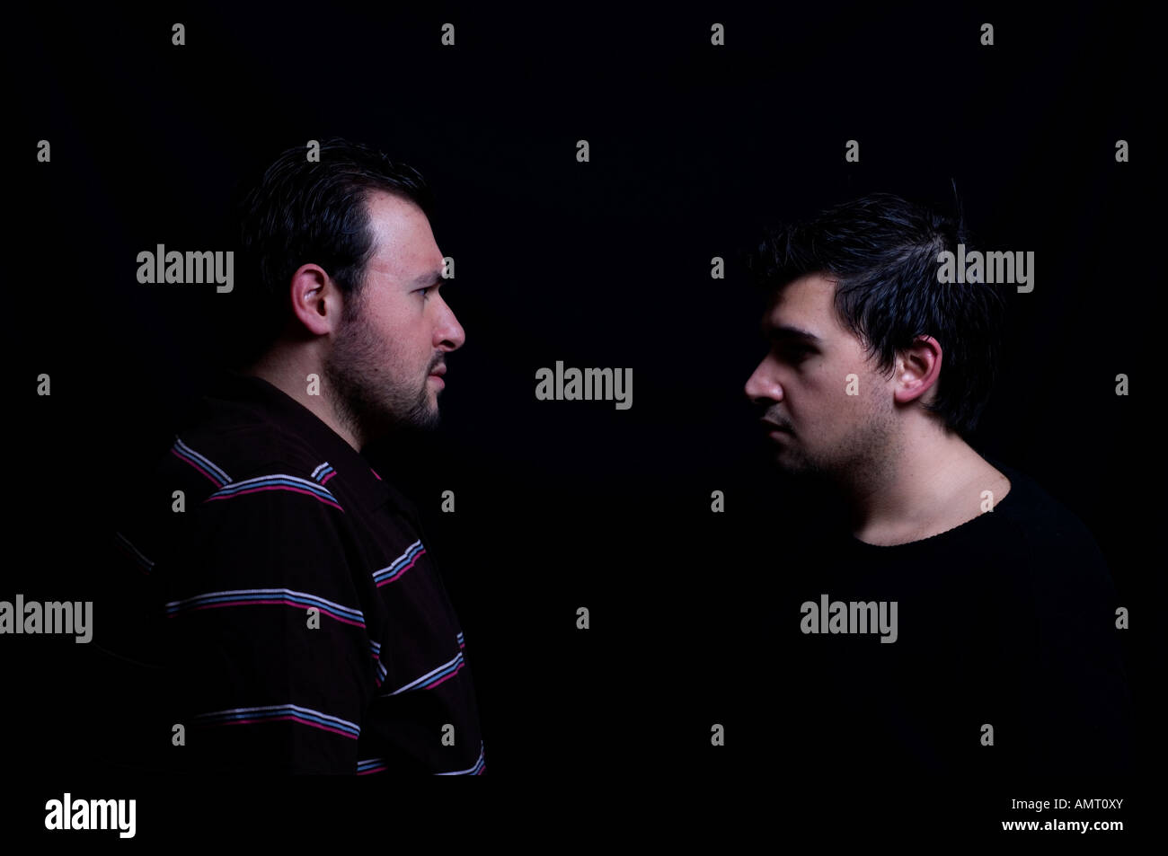 Two men facing each others Stock Photo - Alamy