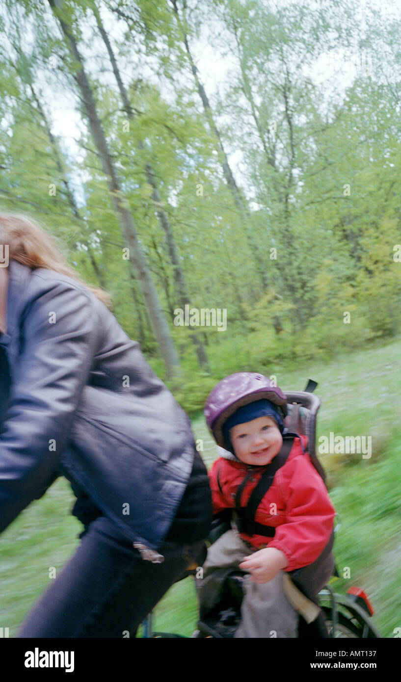 Mother and baby taking a safe ride Stock Photo - Alamy