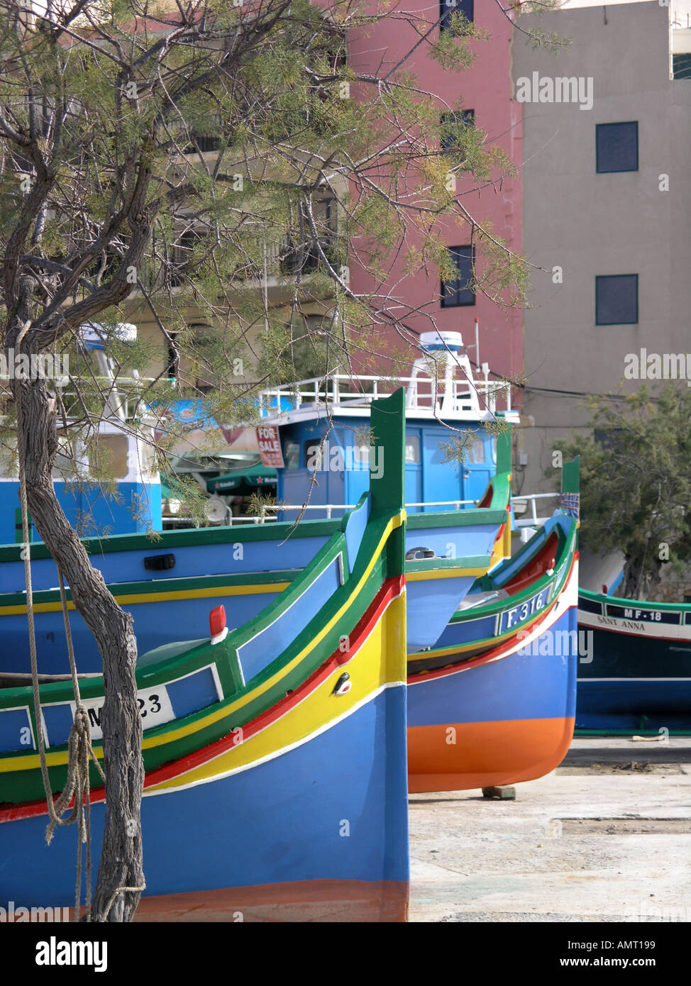 Traditional Maltese fishing boats called Luzzu's in the harbour at ...