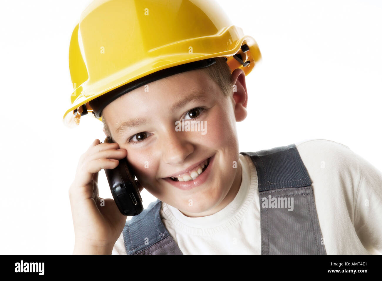Boy wearing helmet using mobile hi-res stock photography and images - Alamy