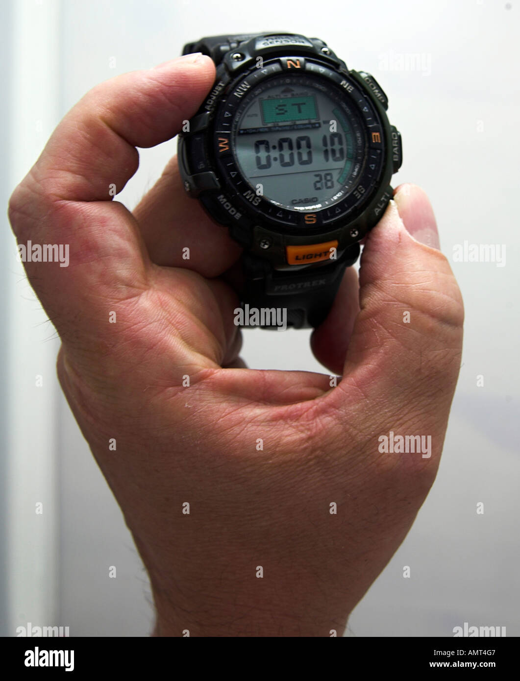 Male hand holding stop watch hi-res stock photography and images - Alamy