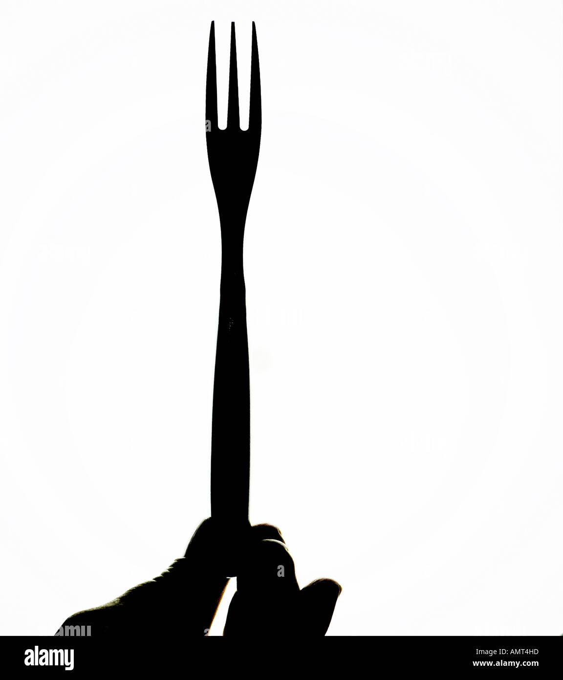 Silhouette of a modern contemporary fork with hand holding it up Stock ...