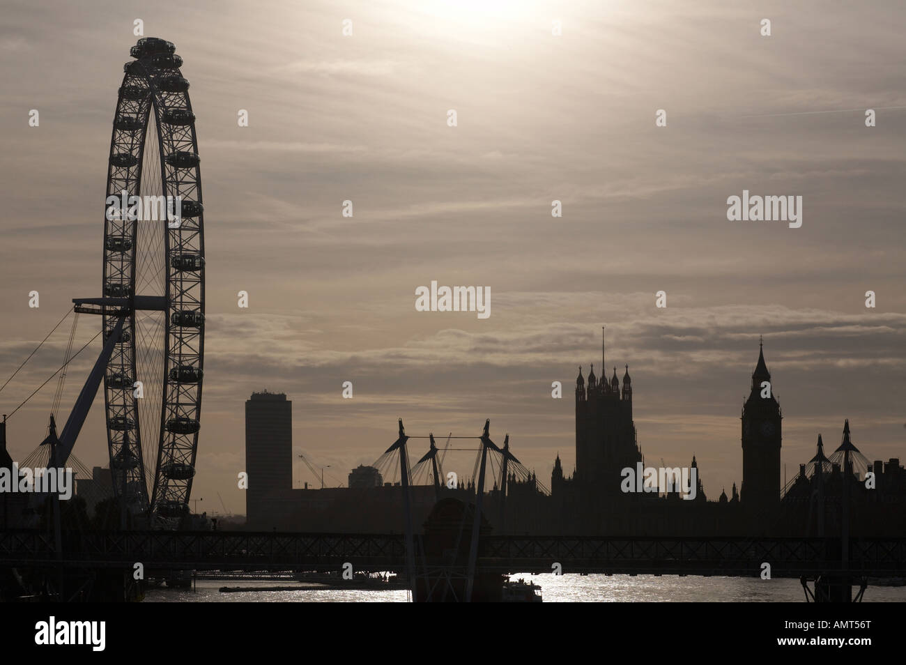London skyline with London Eye and Houses of Parliament at sunset night ...