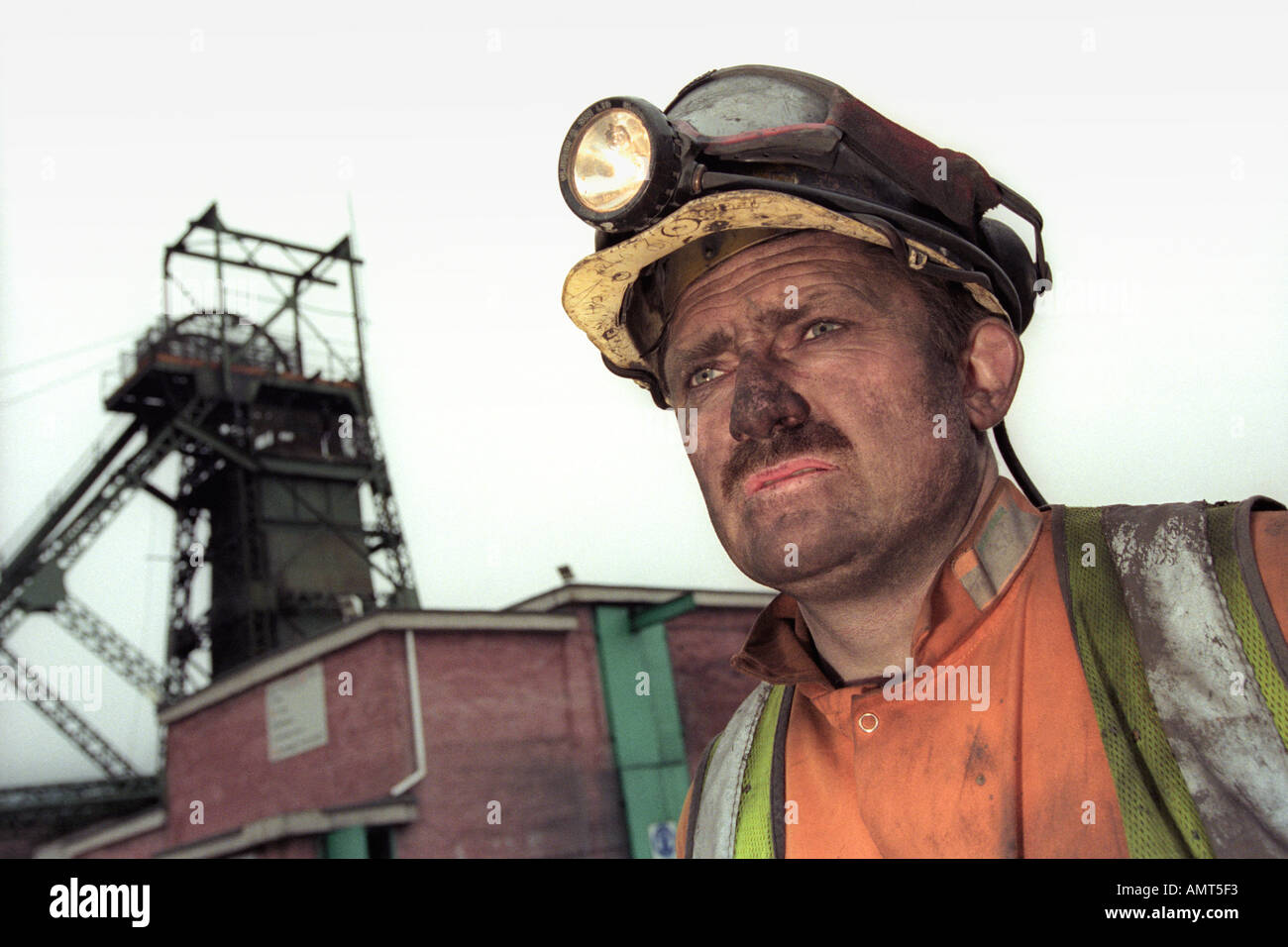 Coal miner at Tower Colliery Hirwaun South Wales with pit head in the ...