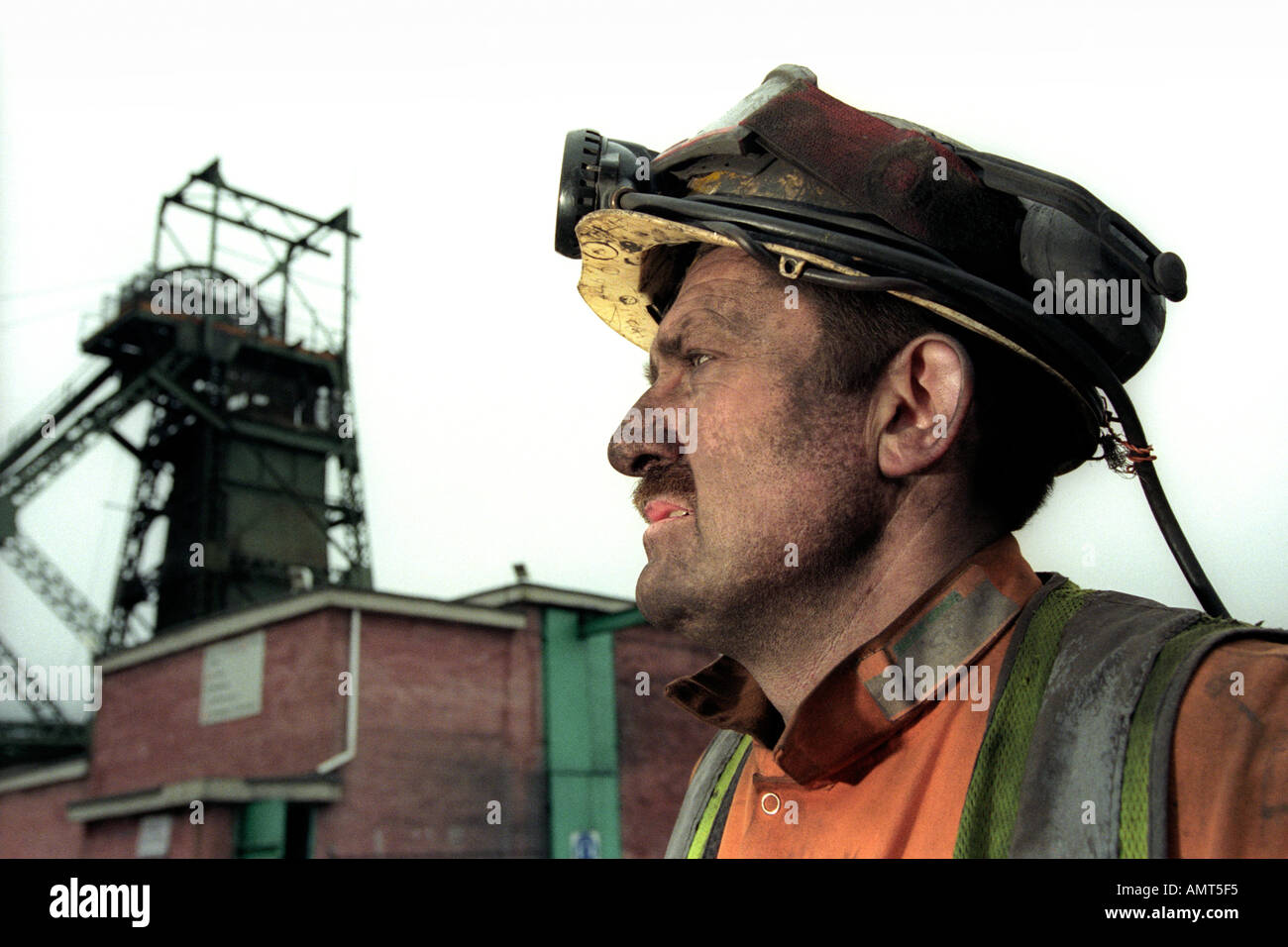 Coal miner at Tower Colliery Hirwaun South Wales with pit head in the ...