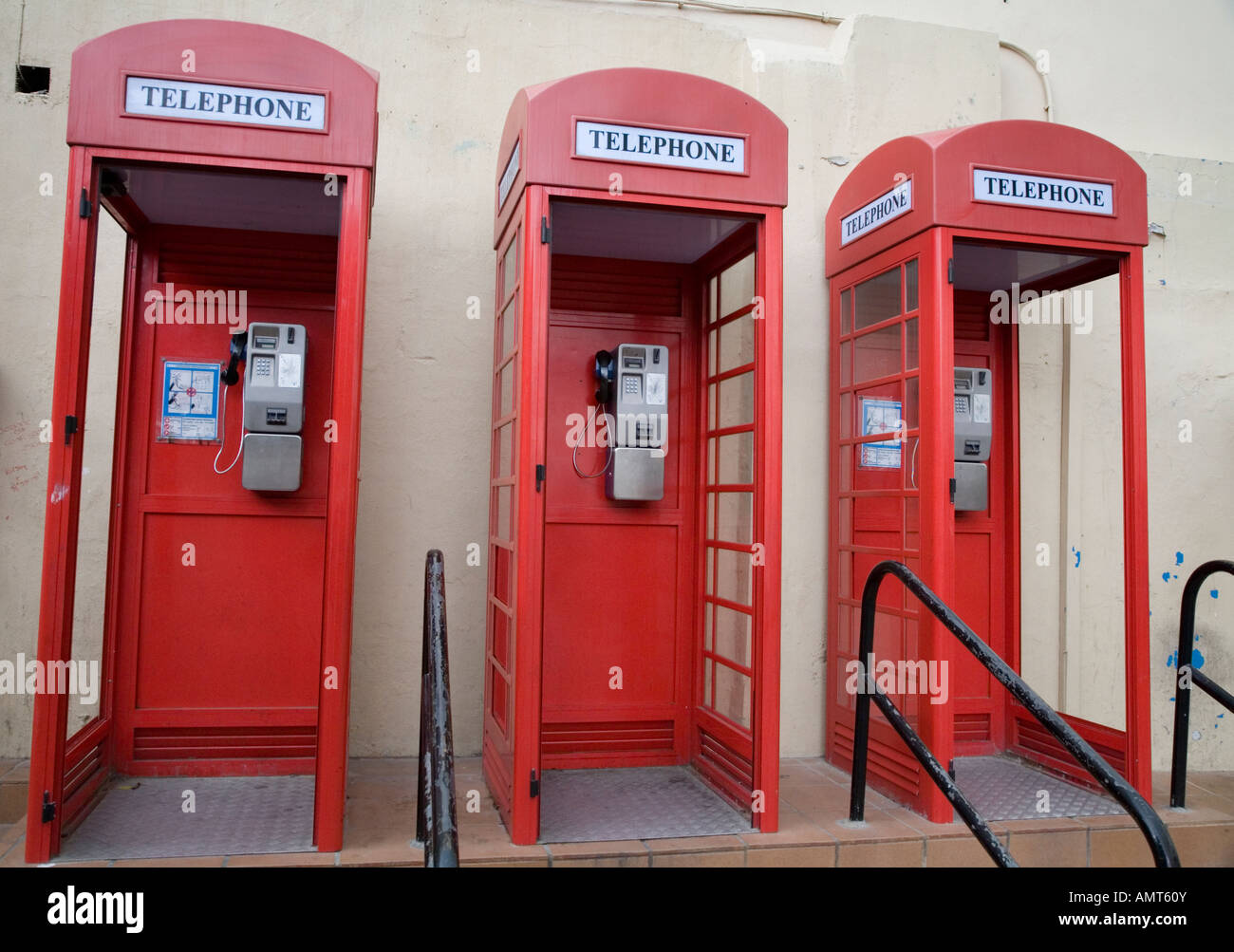 Gibraltar Row of red English style telephone boxes Stock Photo - Alamy