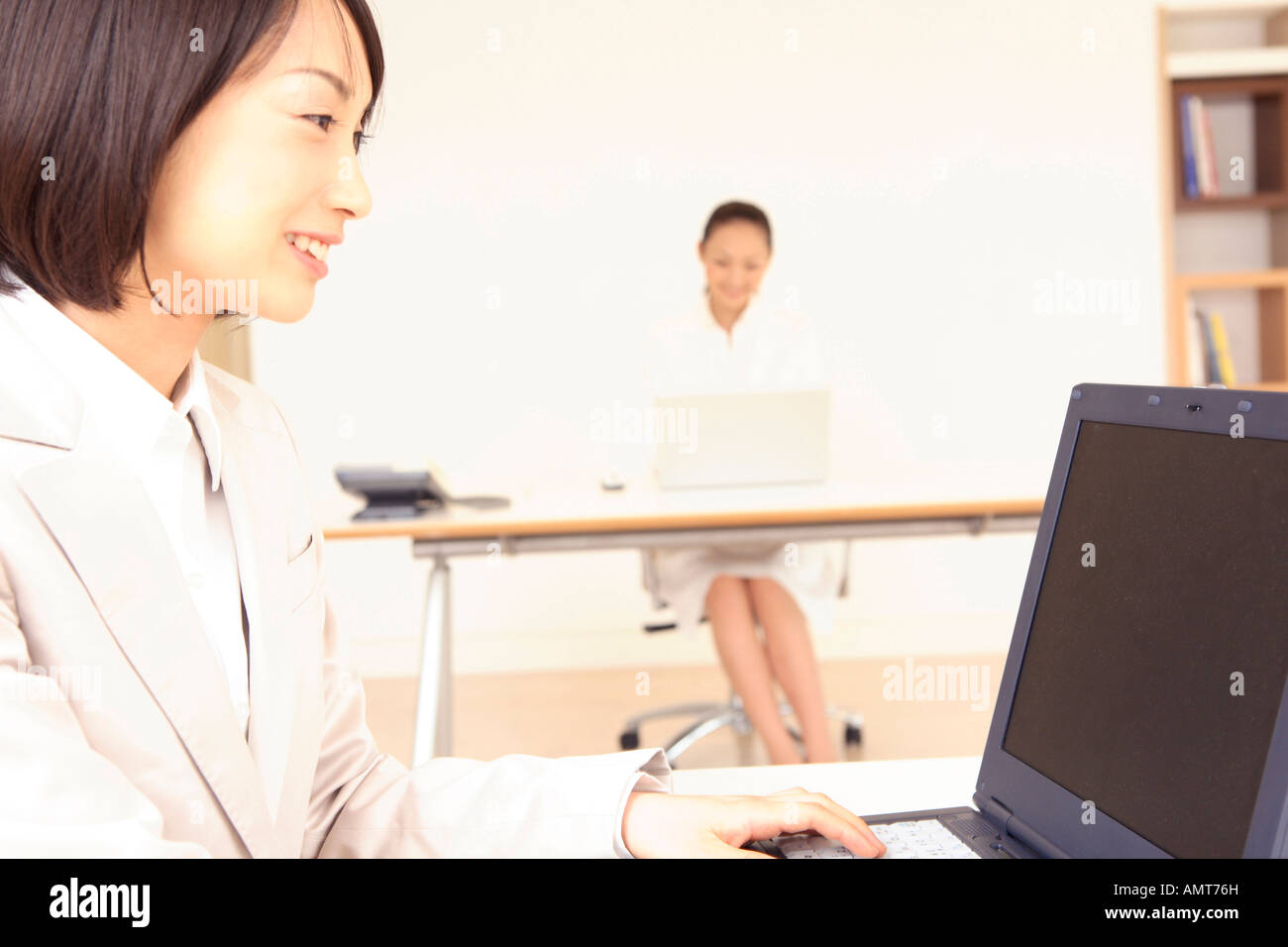 Office lady operating a PC Stock Photo - Alamy