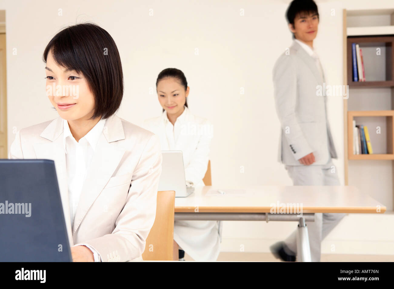 Office lady operating a PC Stock Photo - Alamy