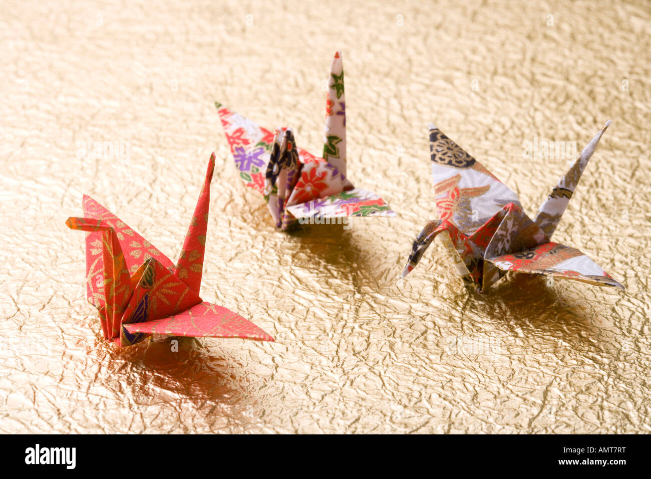 Folded paper crane Stock Photo - Alamy