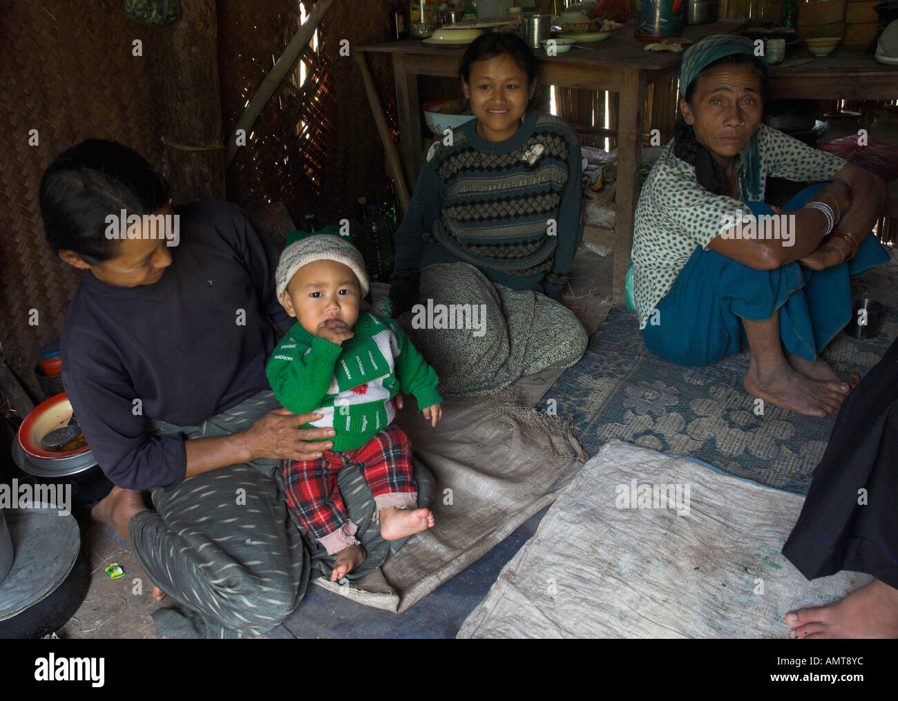 Myanmar Burma Shan State Thit Twin ethnic family seating on the floor ...